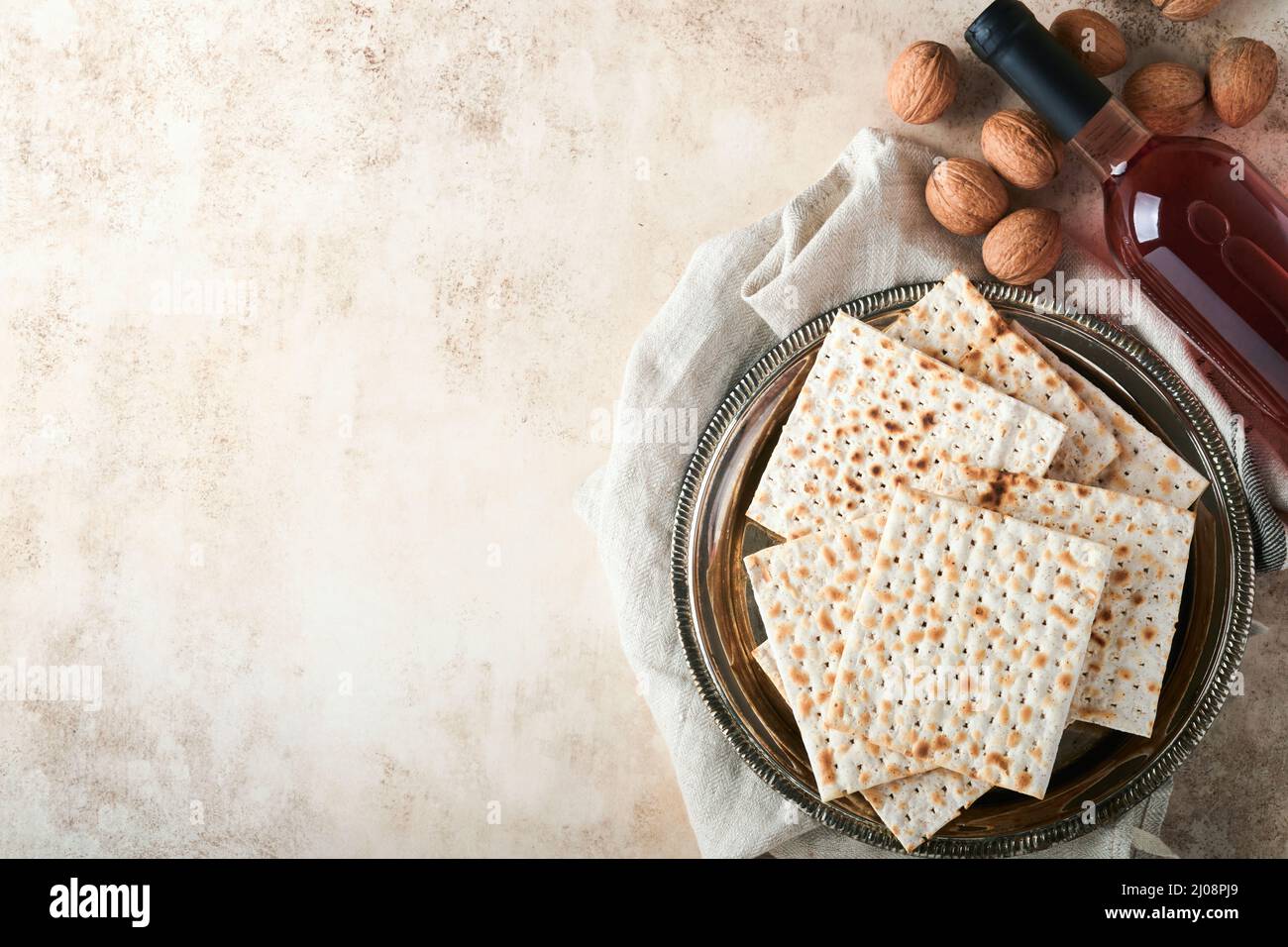 Passover celebration concept. Matzah, red kosher and walnut ...