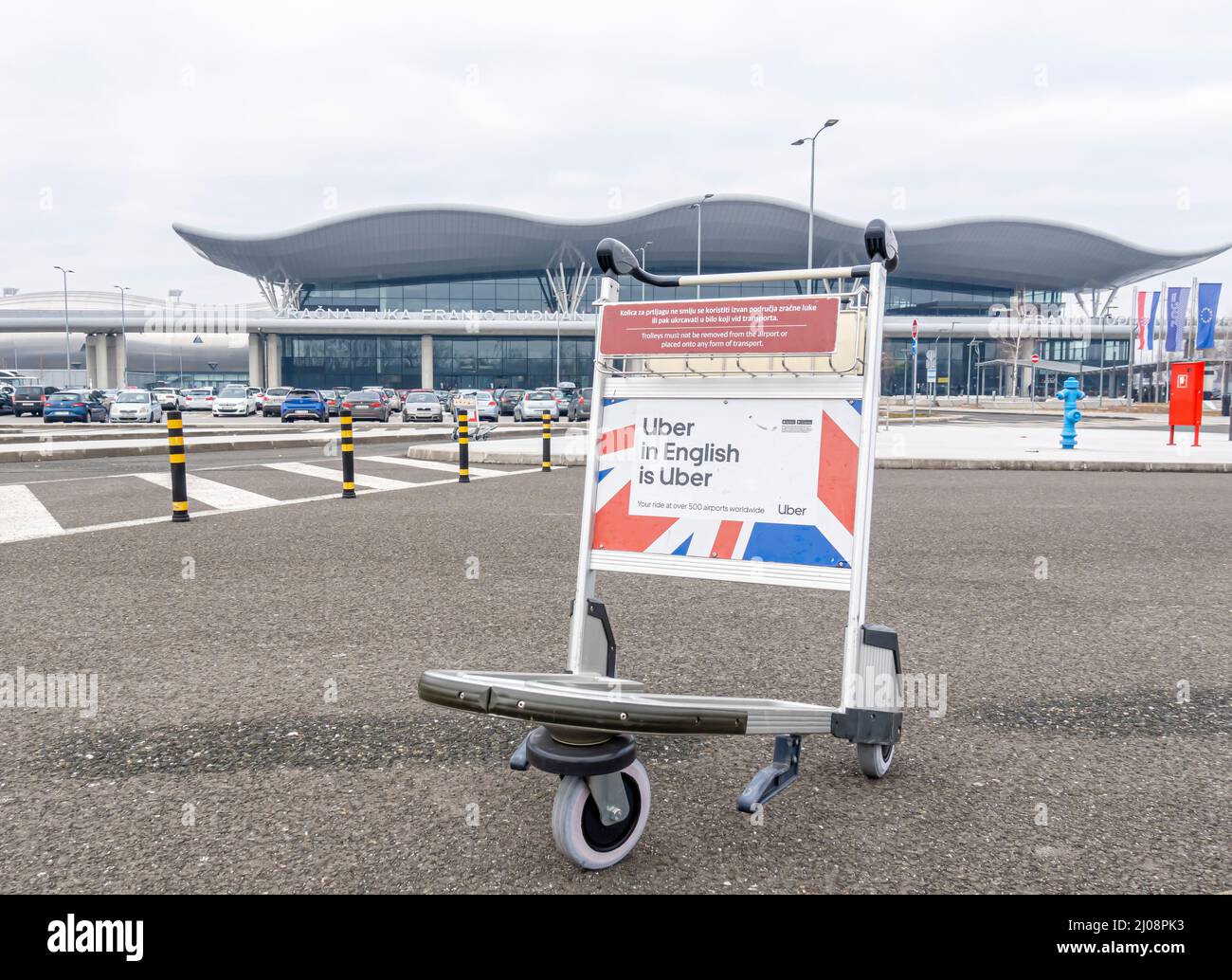 Uber in English advertisement on the trolley cart near Zagreb Airport ...