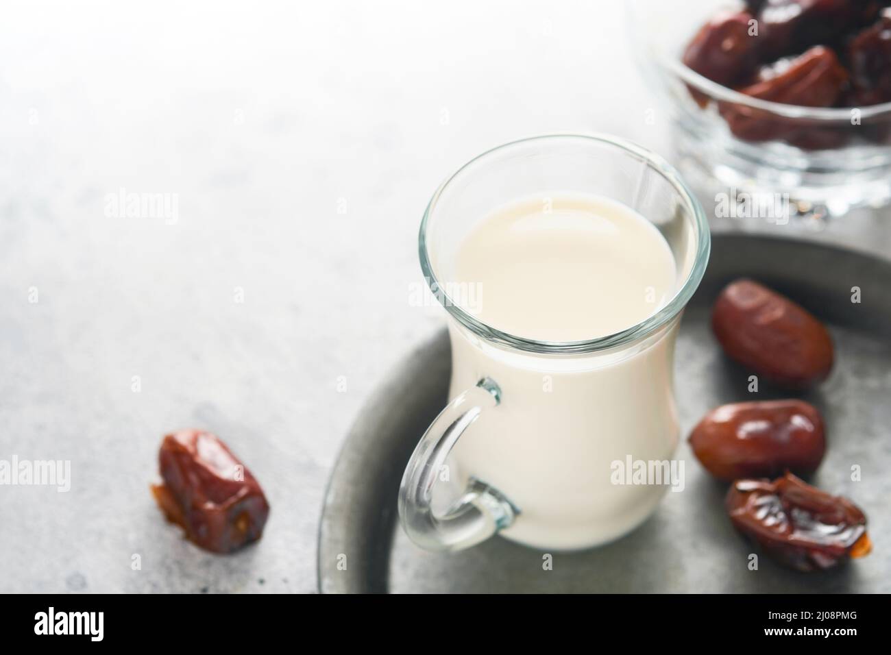 Ramadan Kareem food and drinks. Plate of dates, glass of milk and date ...