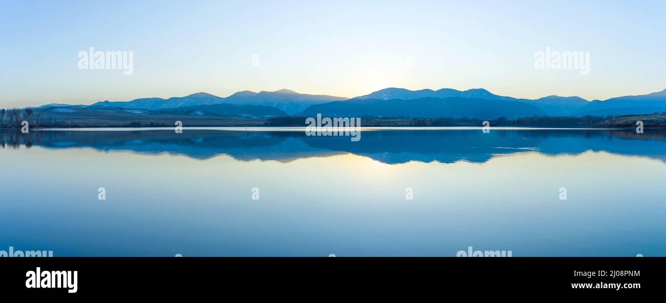 Mountain Lake - A panoramic view of front range mountains reflecting in ...