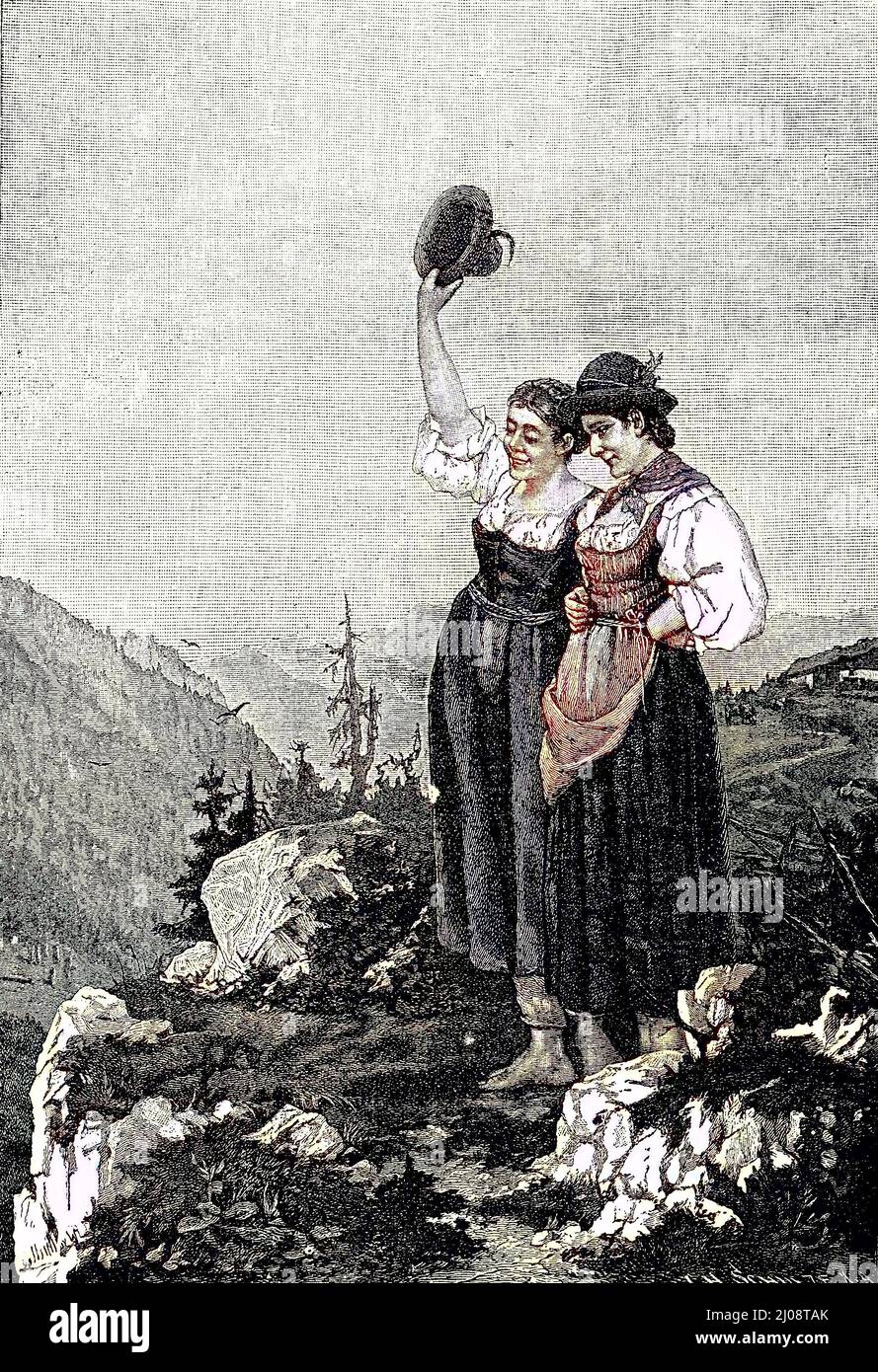 Greeting from the alpine pasture, two women in the Dirndl standing at a ...