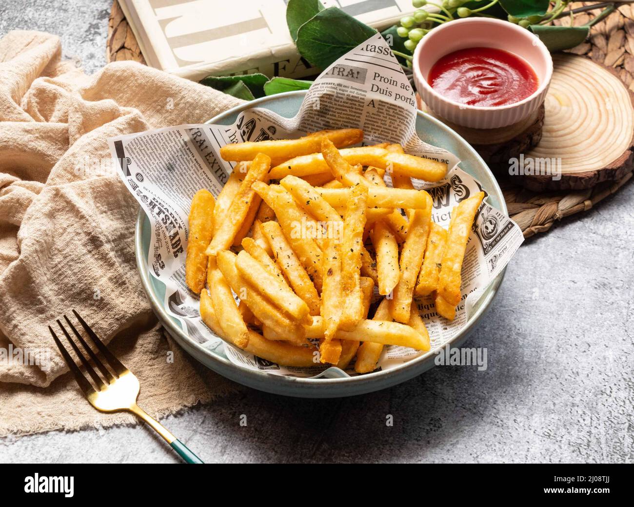 Freshly Fried Crispy Potato fries chips in a dish with ketchup top view ...