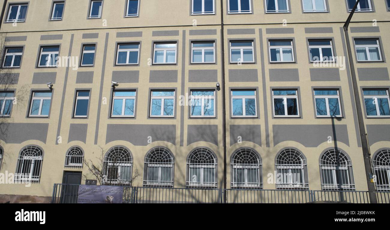 Facade of a historic factory building with rows of windows Stock Photo ...