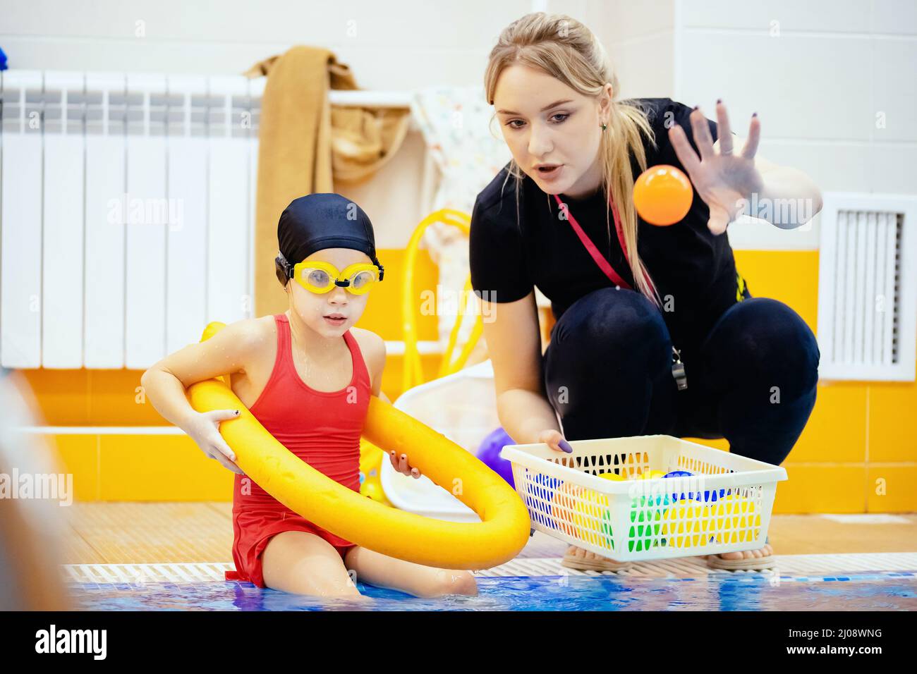 Pink swimming cap hi-res stock photography and images - Alamy