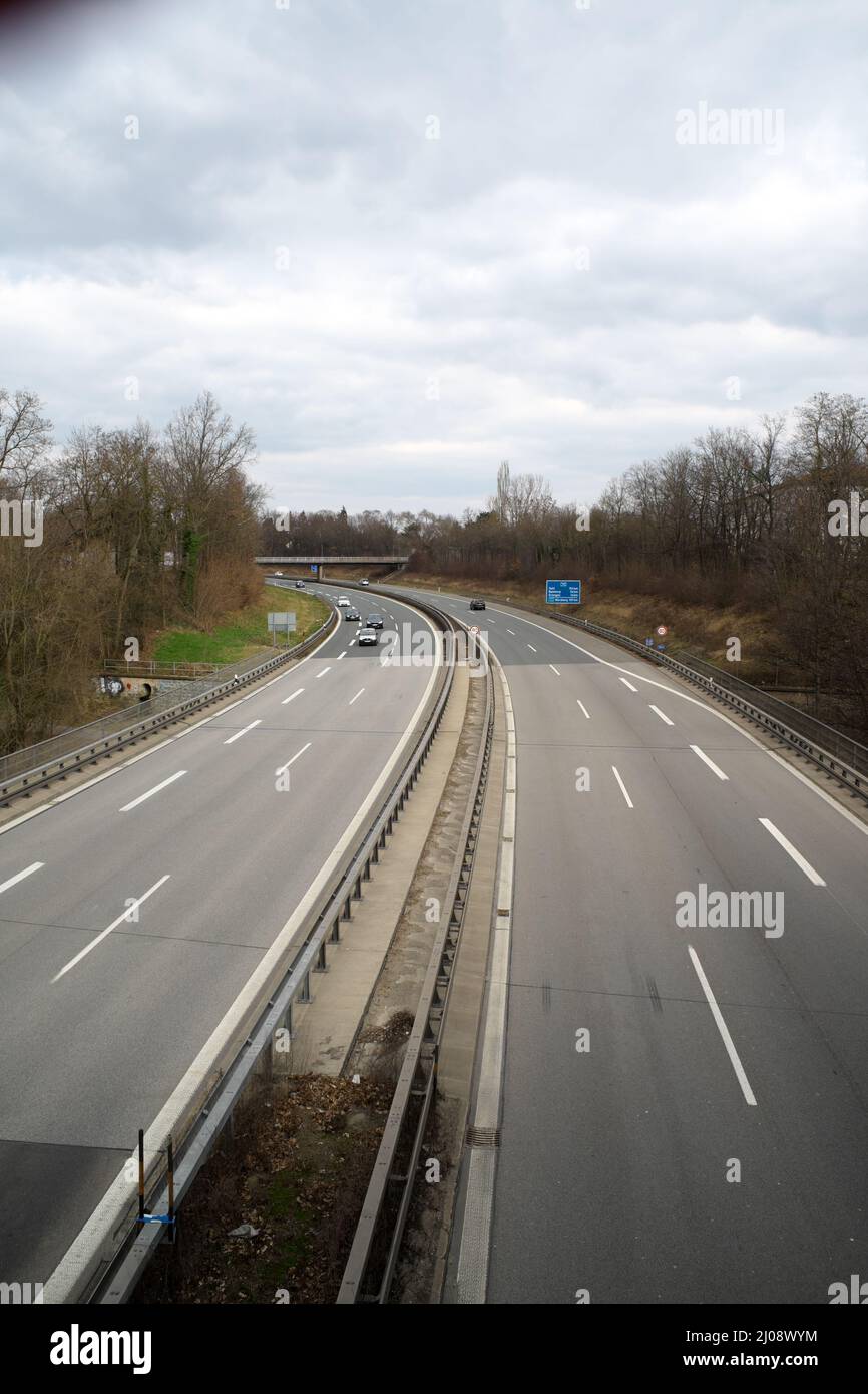 View of motorway, lined by trees, with few vehicles Stock Photo - Alamy
