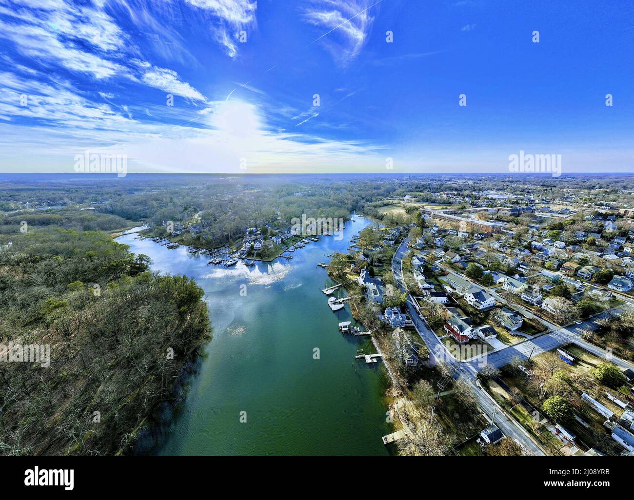 Aerial shot of a town spread over the riverside Stock Photo - Alamy