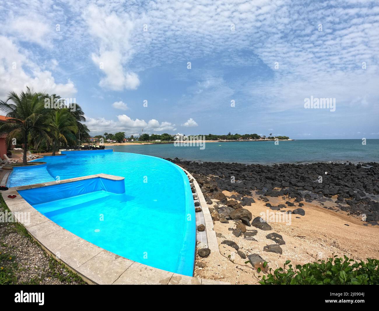Aerial view of a beautiful sea from a swimming pool in Sao Tome, Africa ...