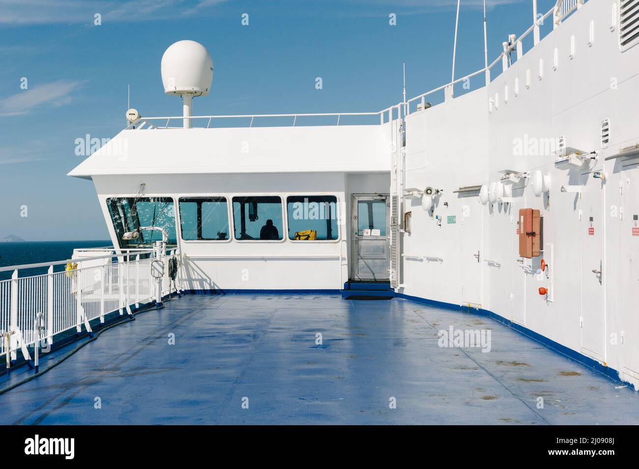 Navigational bridge with an officer of the watch on an Irish Sea ferry ...
