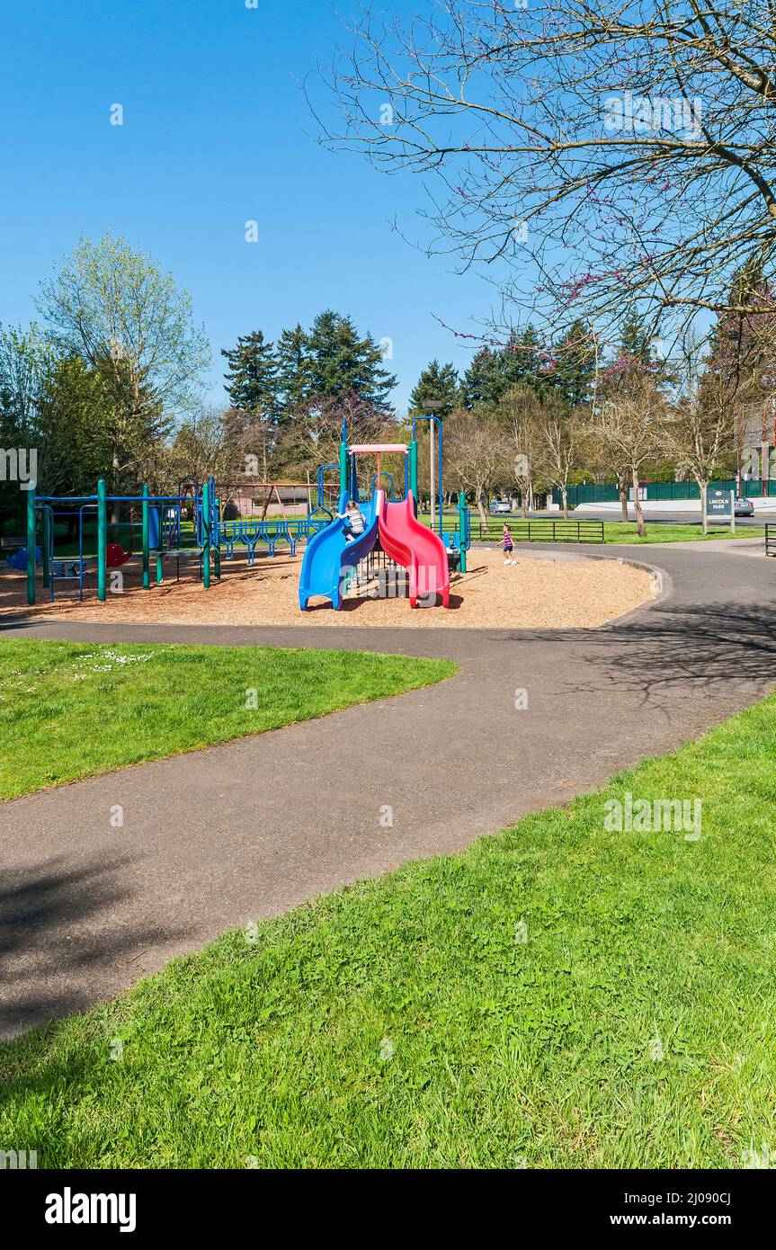Children playing near slides at the Lincoln Park playground in Portland ...