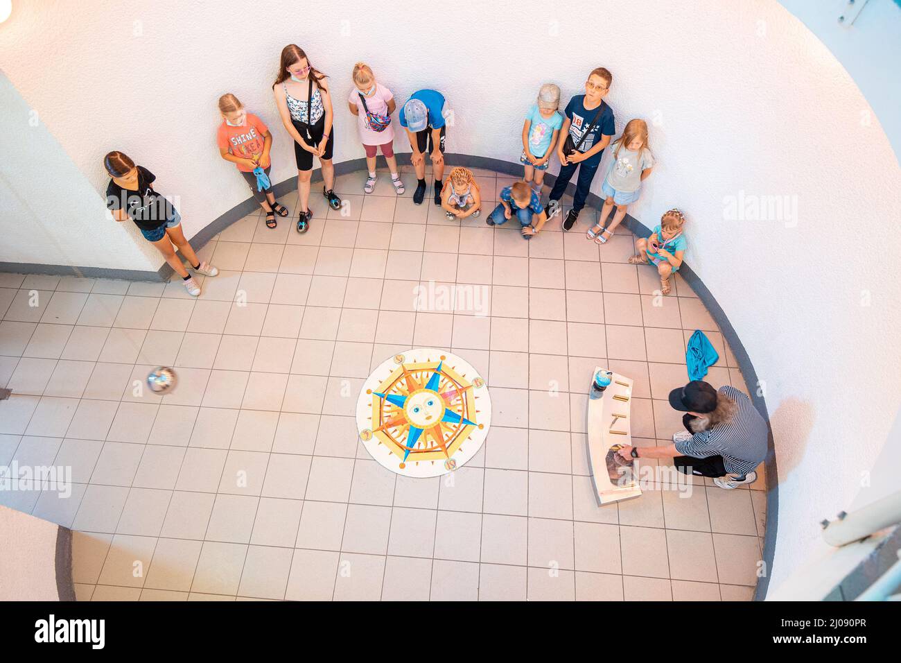 10 July 2021, Novosibirsk, Russia: The planetarium guide demonstrates a ...