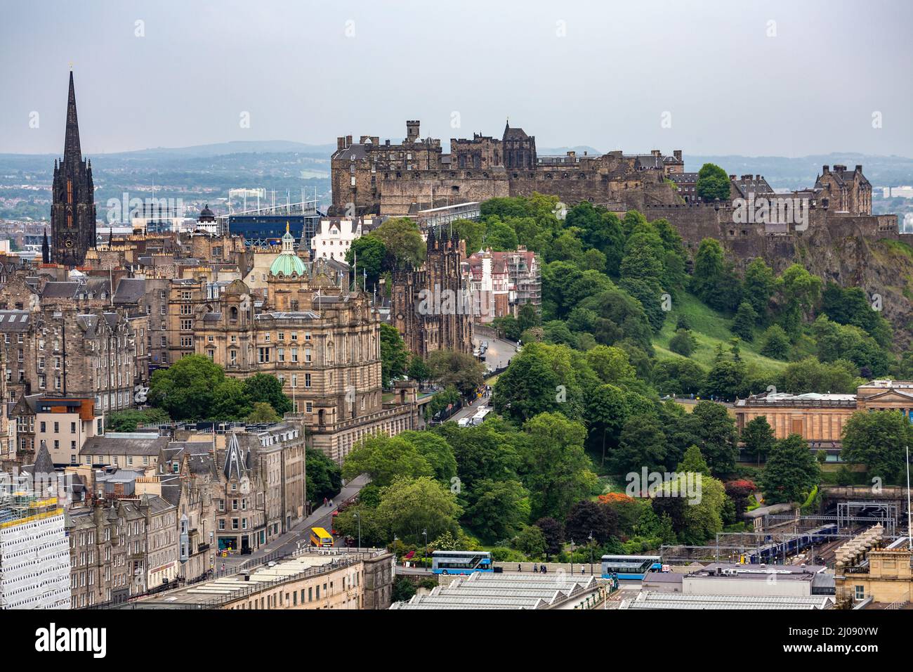 Low angle shot of Calton Hill with a castle in Edinburgh, Scotland, UK ...