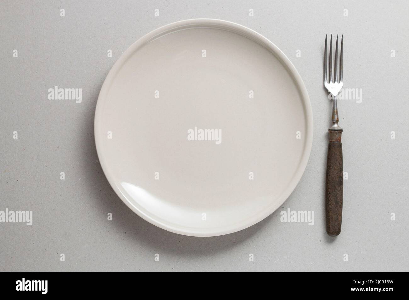 Top view empty plate. Idea of hunger Stock Photo - Alamy