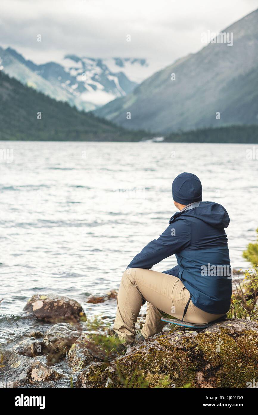 Male hiker adventurer sits hi-res stock photography and images - Alamy