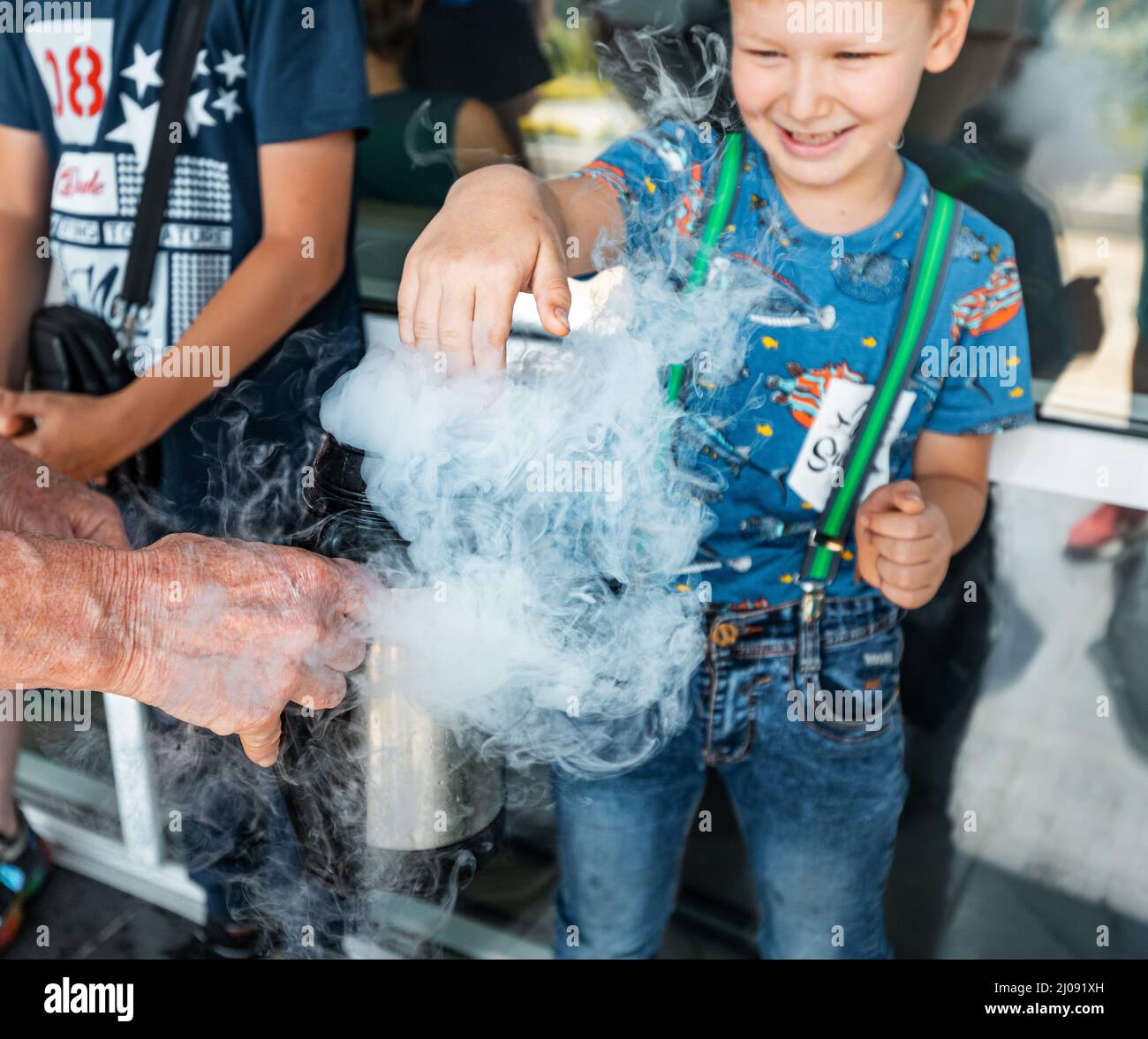 10 July 2021, Novosibirsk, Russia: teacher making an chemical and ...