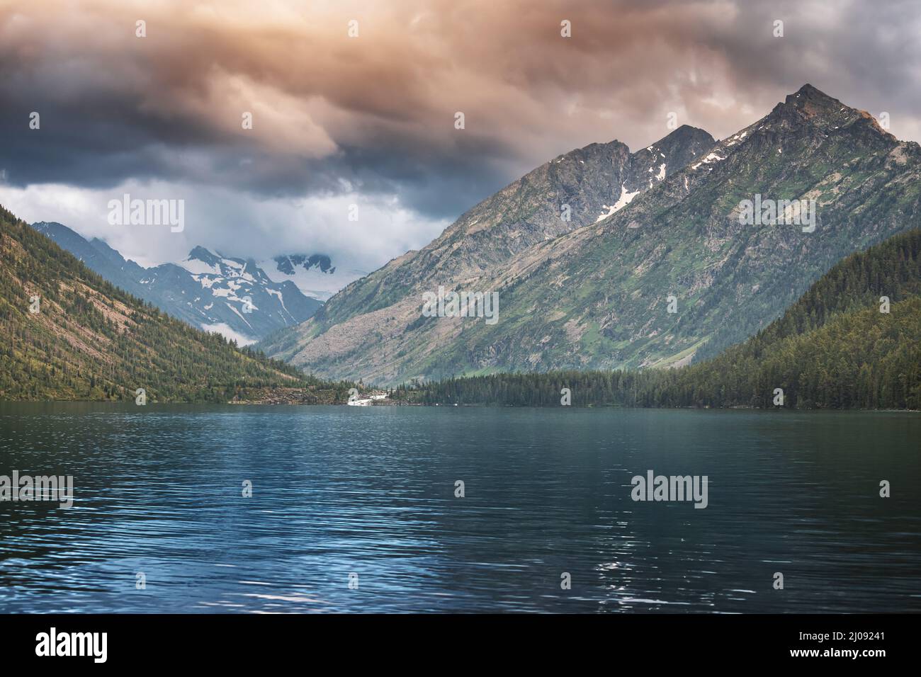 Atmospheric and moody landscape of lower Multa Lake at misty and cloudy ...