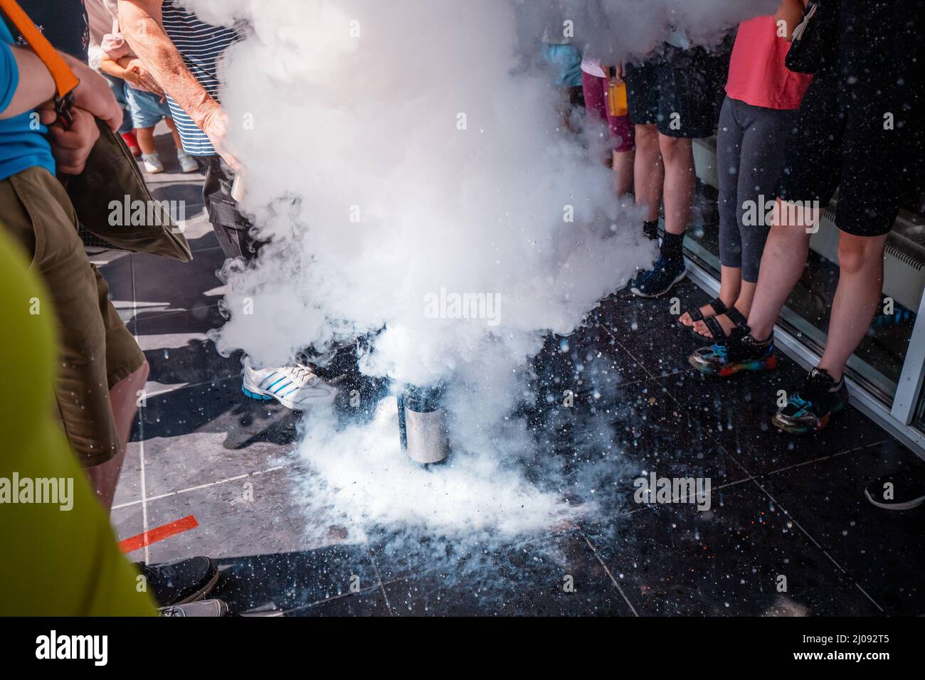 The teacher making an chemical and physical experiment with liquid ...
