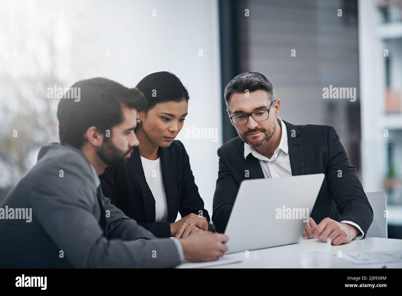 Theyre a team that gets things done. Shot of three businesspeople ...
