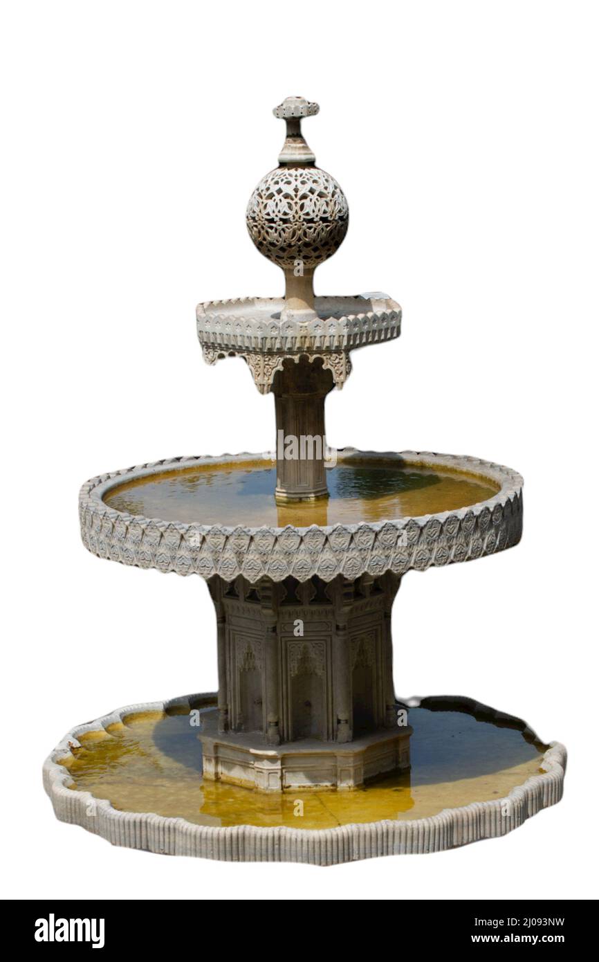 Vertical shot of a decorative fountain isolated on white background ...