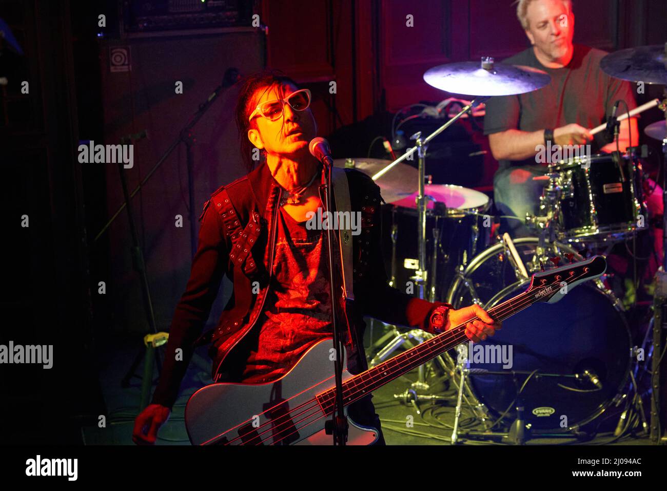 Bassist Pando performing with eighties New Wave band A Flock of ...