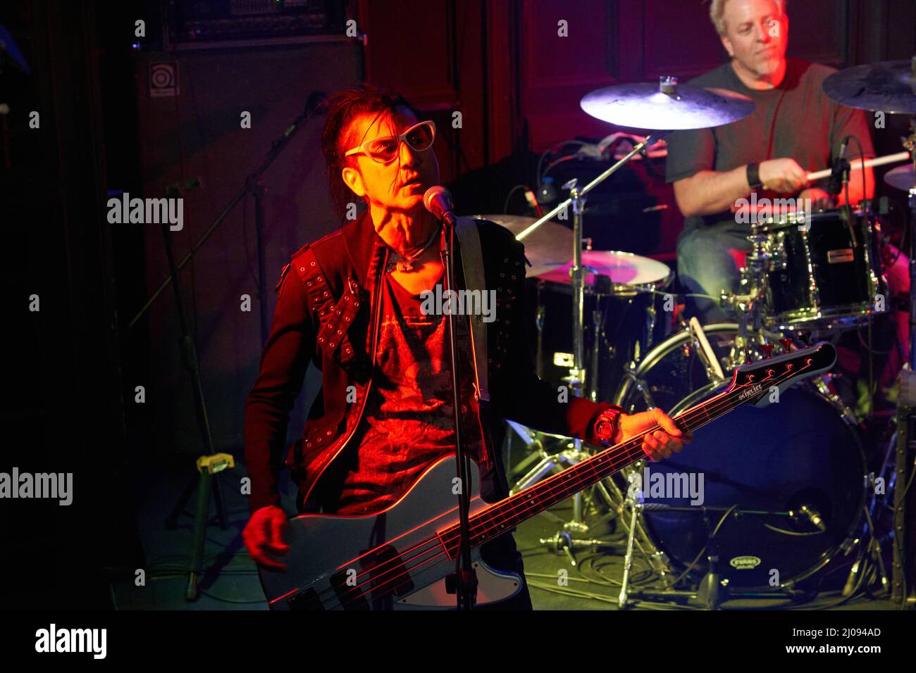 Bassist Pando performing with eighties New Wave band A Flock of ...
