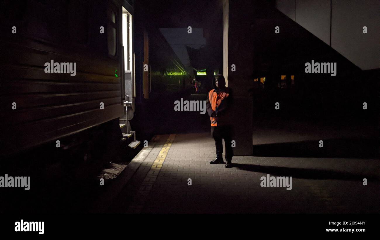 Kyiv, Ukraine. 17th Mar, 2022. A train conductor prepares to board a ...