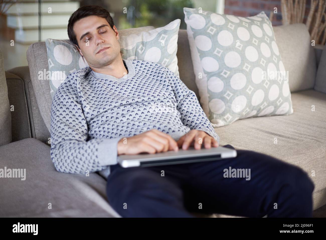 Taking a nap after giving his fingers a workout. Shot of a man sleeping ...