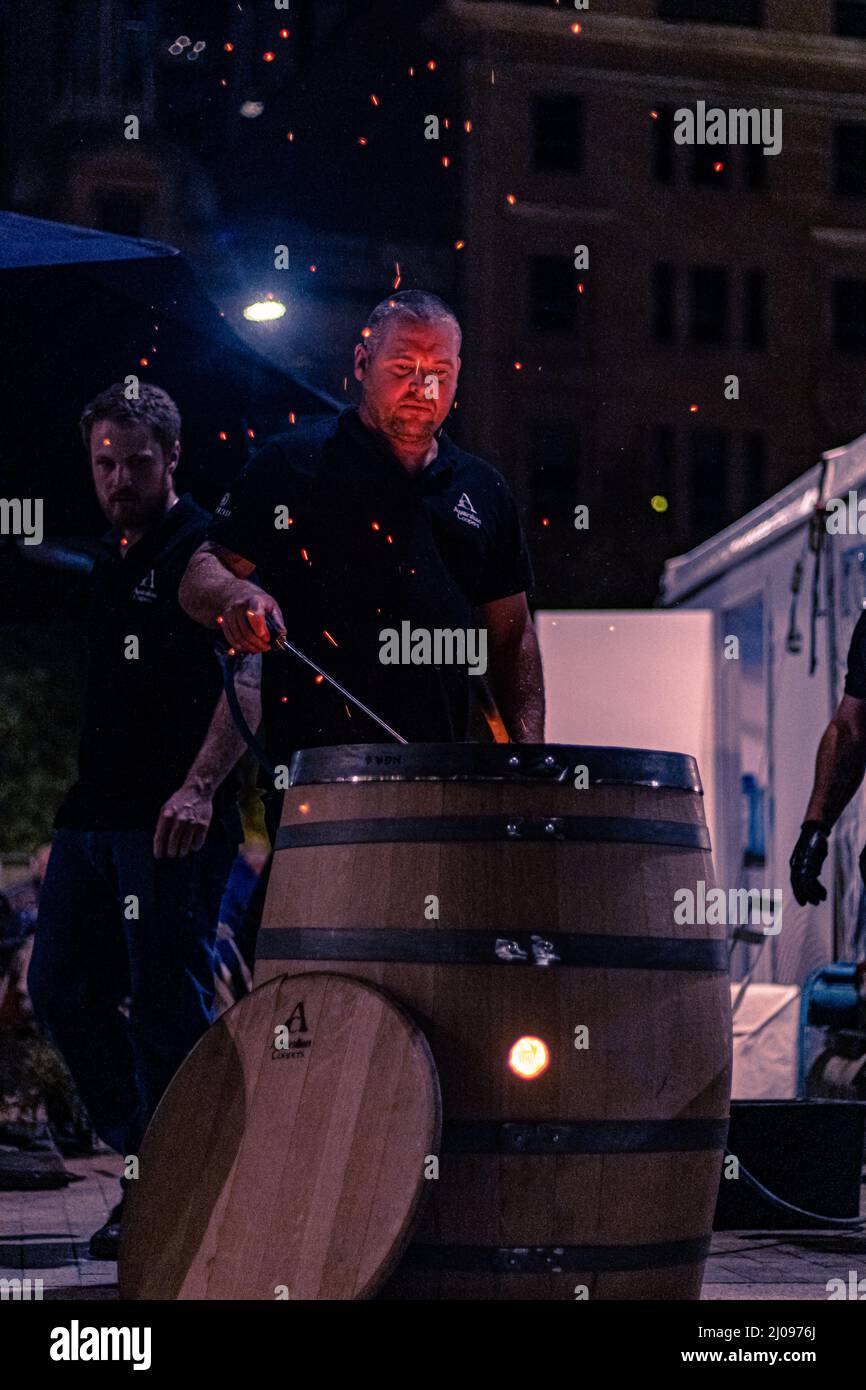 Man burning the inside of a wooden barrel Stock Photo - Alamy