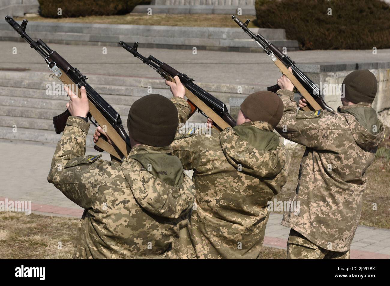 Ukrainian soldiers with assault rifle AK. Servicemen fire rounds in the ...