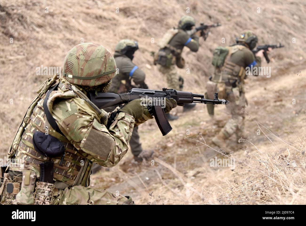 Soldiers during combat. Ukrainian soldiers with assault rifle take part ...