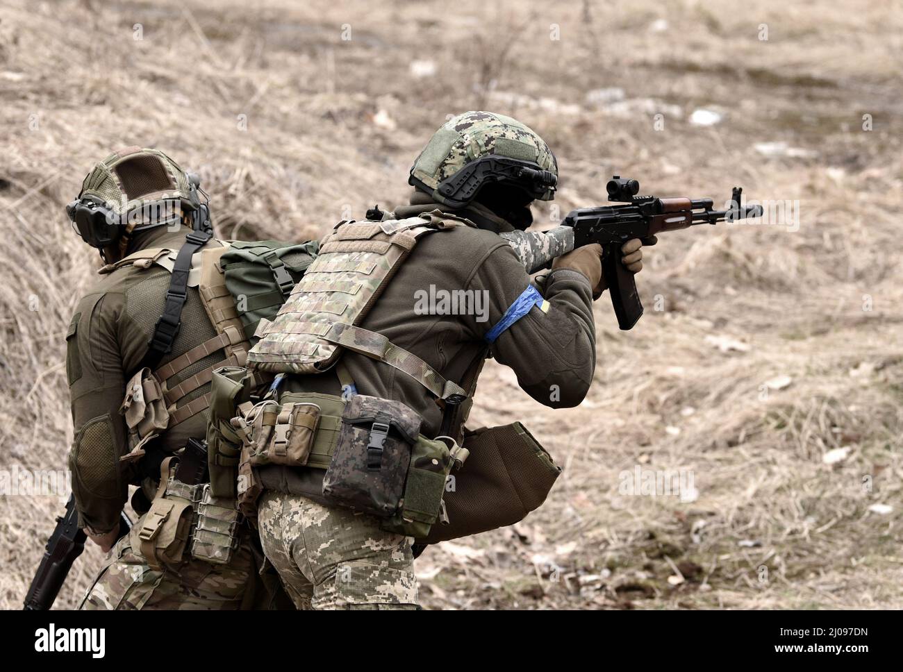 Soldiers during combat. Ukrainian soldiers with assault rifle take part ...