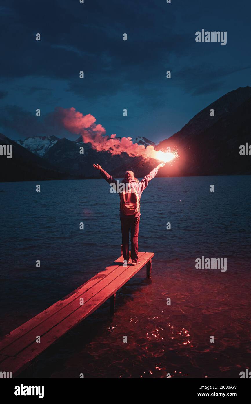 The hiker on the pier lit the emergency red torch and calling for help ...