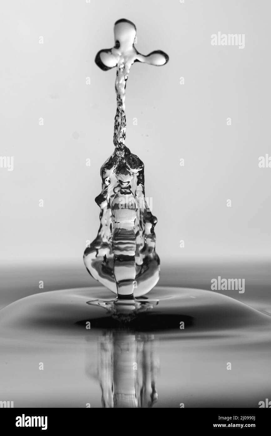 Closeup of a water splash on a grey background Stock Photo - Alamy