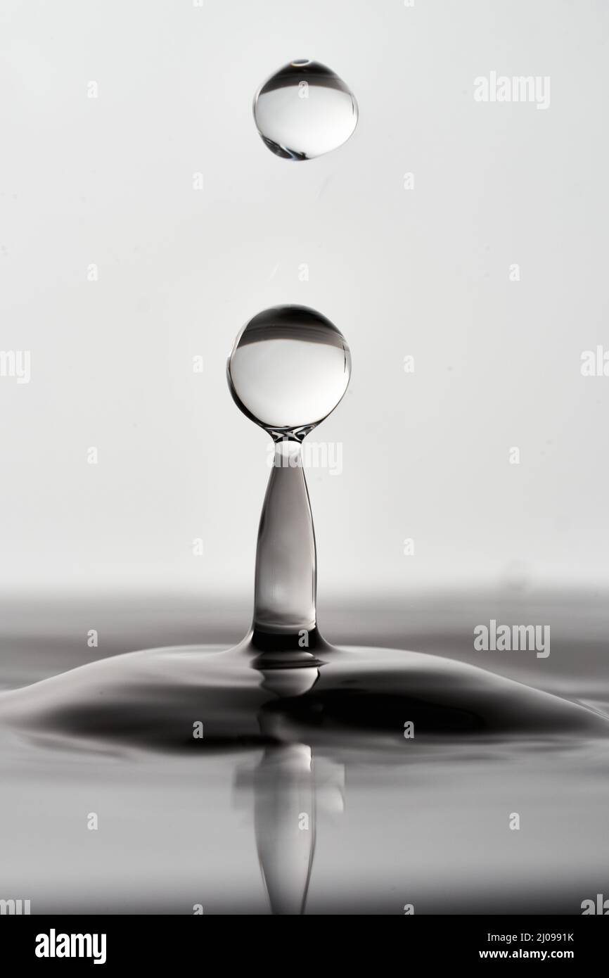 Closeup of a water splash on a grey background Stock Photo - Alamy