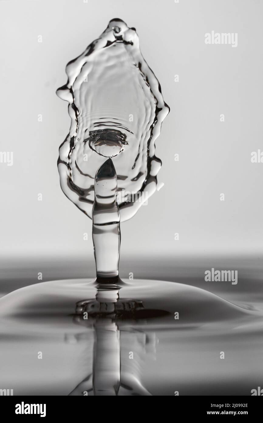 Closeup of a water splash on a grey background Stock Photo - Alamy