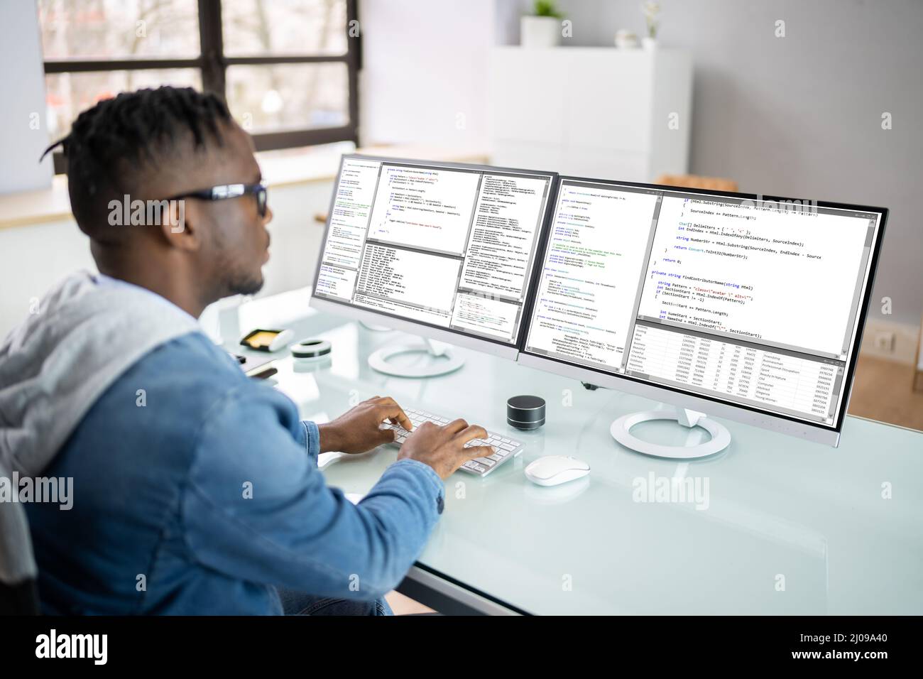 African American Coder Using Computer At Desk. Web Developer Stock ...