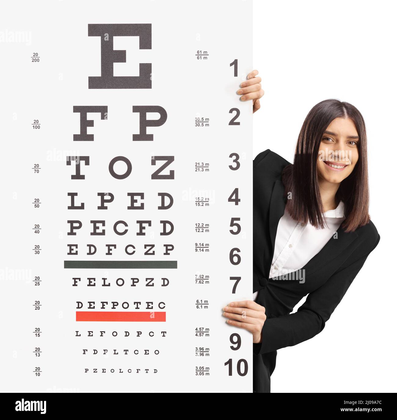 Young woman behind an eye vision examination panel isolated on white ...