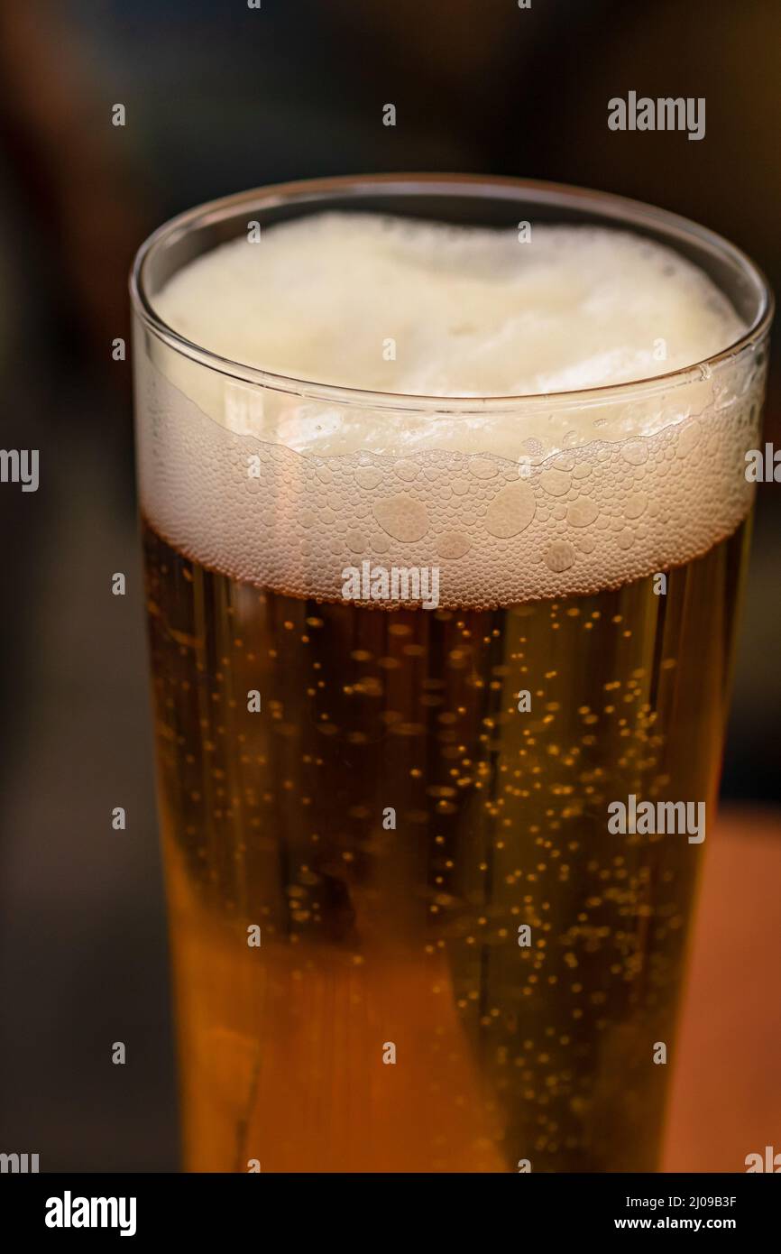 Beer glass in bar on the table Stock Photo - Alamy
