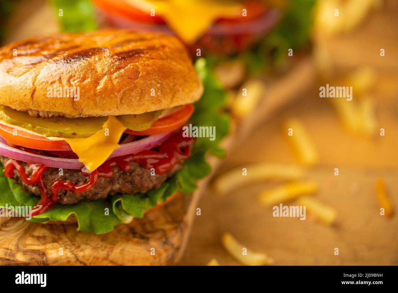 Top view of appetizing burgers with beef, tomato, lettuce, red onion ...