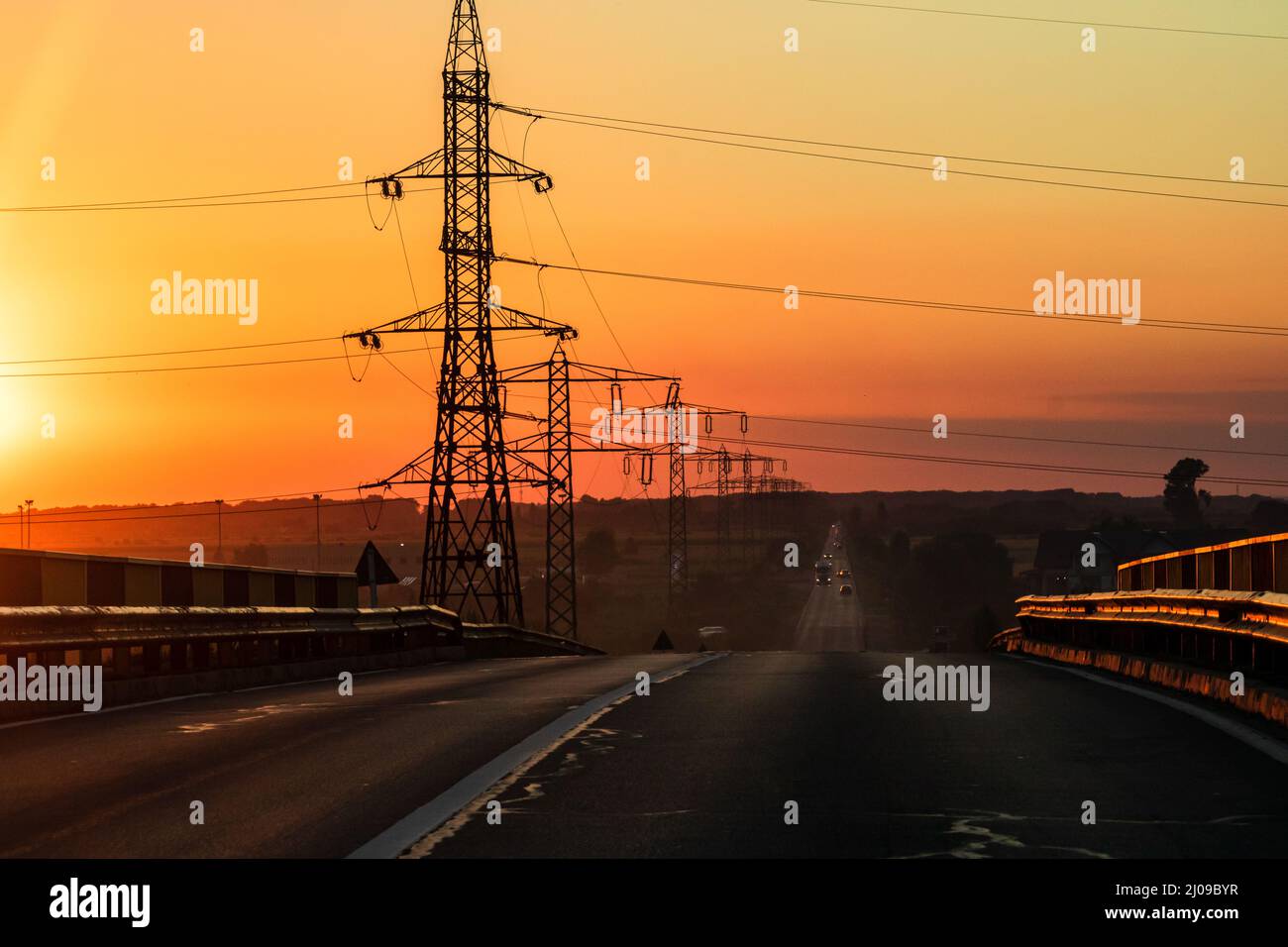 Electric power pylon, electric tower at sunset Stock Photo - Alamy