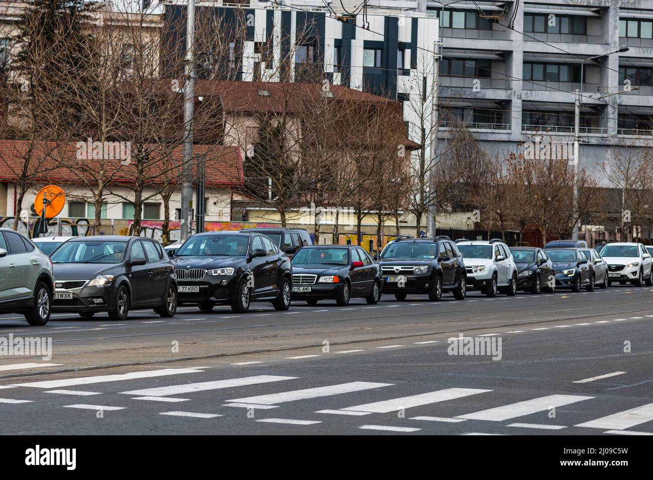 Car traffic at rush hour in downtown area of the city. Car pollution ...