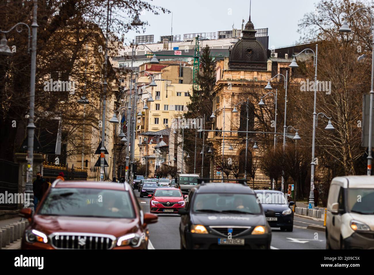 Car traffic at rush hour in downtown area of the city. Car pollution ...