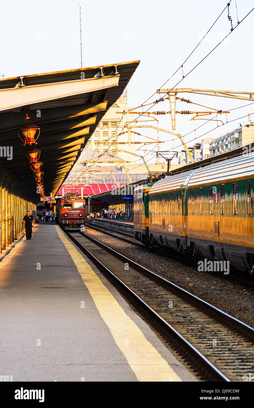 Detail of train in motion at train platform at Bucharest North Railway ...