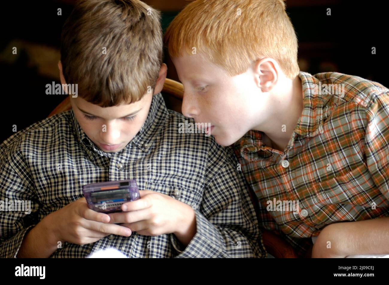 Kids face in same family playing computer games together at family ...