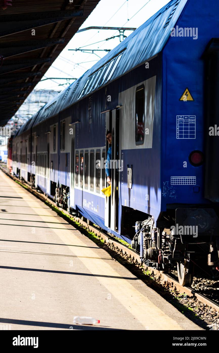 Train in motion or at train platform at Bucharest North Railway Station ...