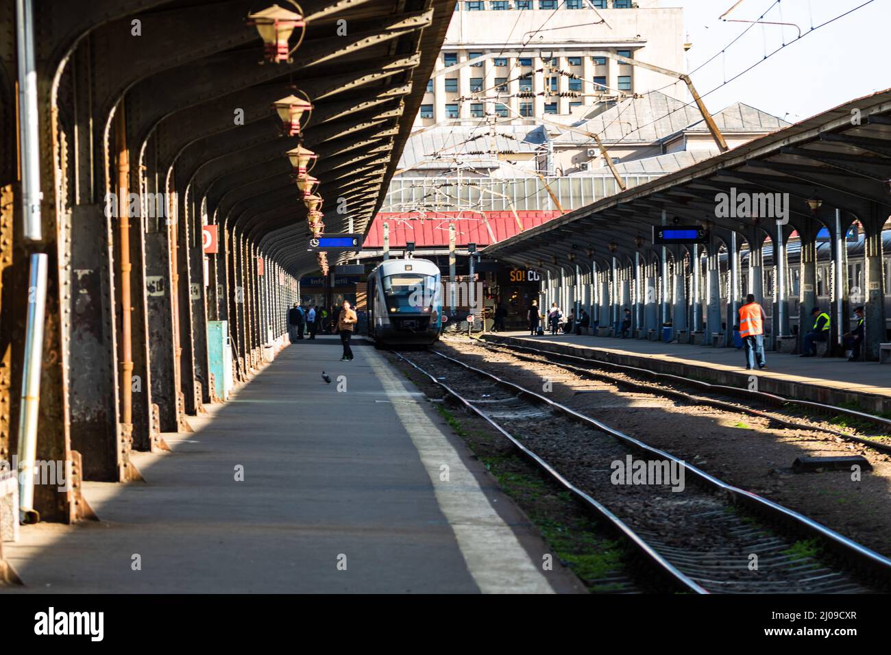 Train in motion or at train platform at Bucharest North Railway Station ...