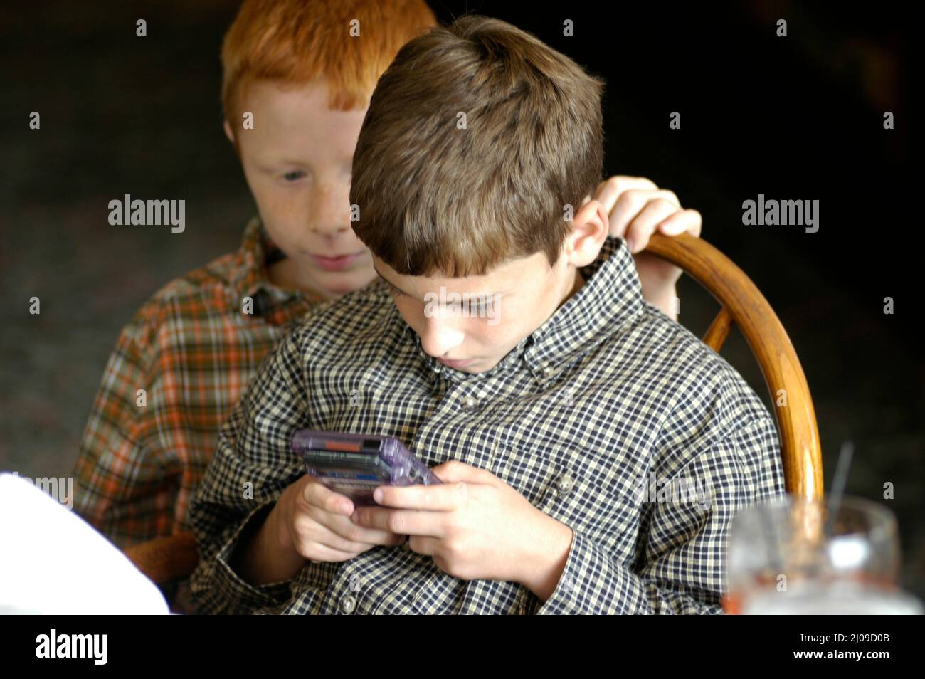 Kids face in same family playing computer games together at family ...