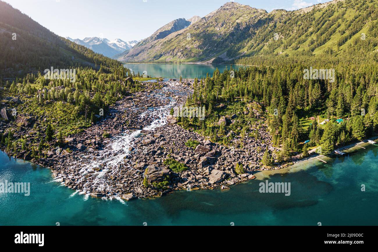 Two wonderful mountain lakes connected by a stream channel with a rapid ...