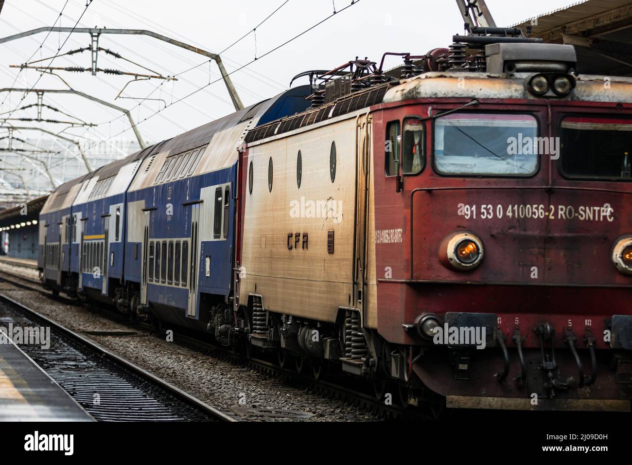 Train in motion or at train platform at Bucharest North Railway Station ...