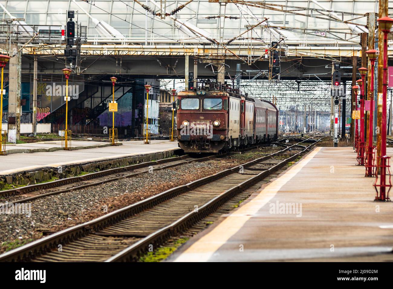 Train in motion or at train platform at Bucharest North Railway Station ...
