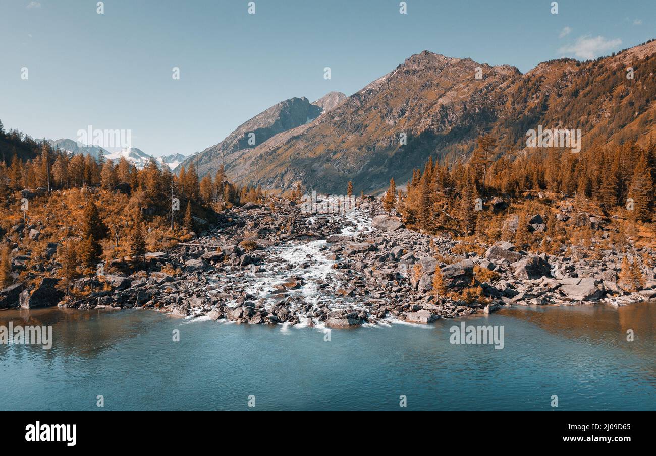 Two wonderful mountain lakes connected by a stream channel with a rapid ...